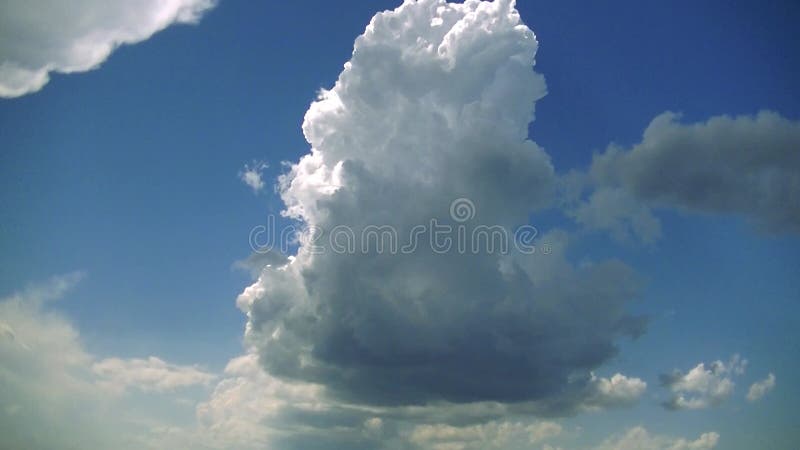 Cumulus Clouds Float Across a Clear Blue Sky. Storm and Rain Clouds at ...