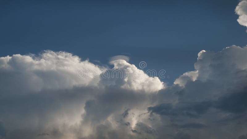 Cumulus Clouds with a Small Lenticular Cloud Stock Image - Image of ...