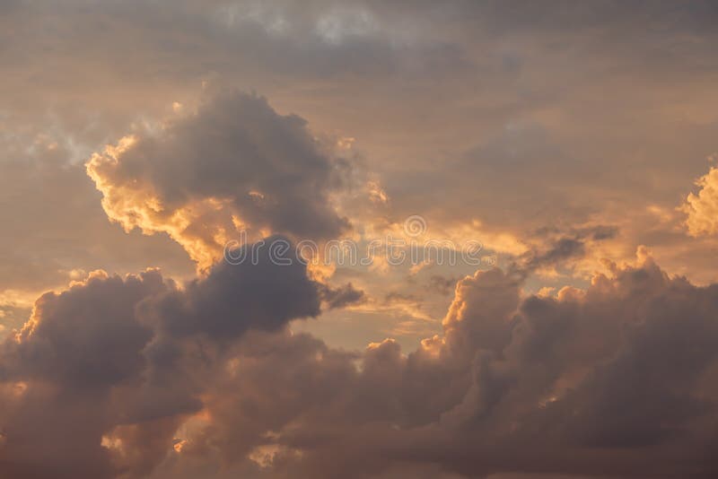 Cumulus clouds at sunset stock image. Image of storm - 268538685