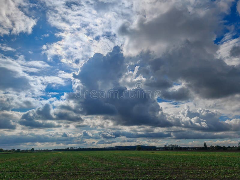 Cumulus or Cluster Clouds Moving Over a Field Stock Photo - Image of ...