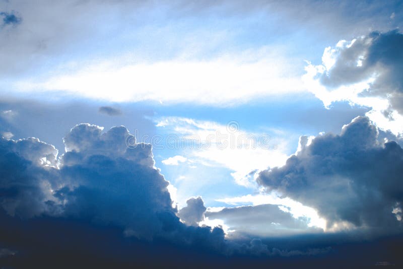 Cumulus Sunset Clouds with Sun Setting Down Stock Photo - Image of ...