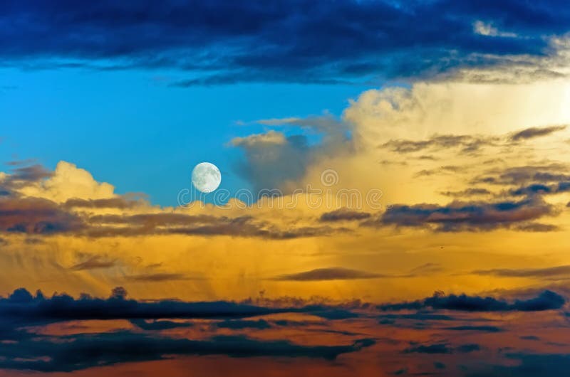 Full Moon Peeking Out from Behind the Clouds, Sunset Sky Stock Photo ...