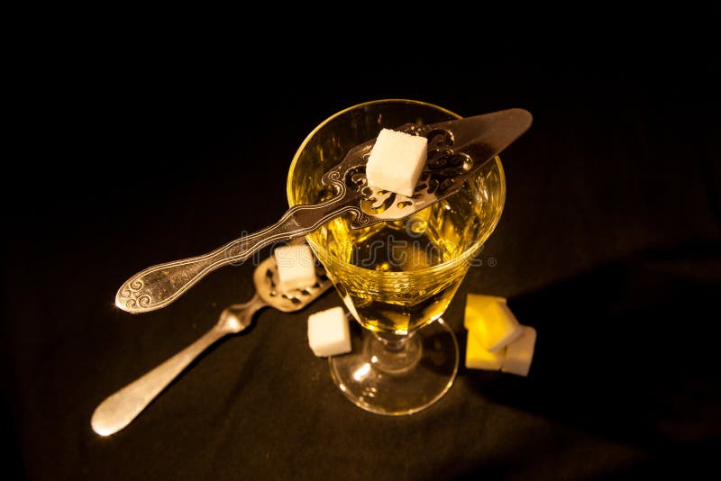 Cup of absinthe wit spoon stock image. Image of absinthe - 78212047