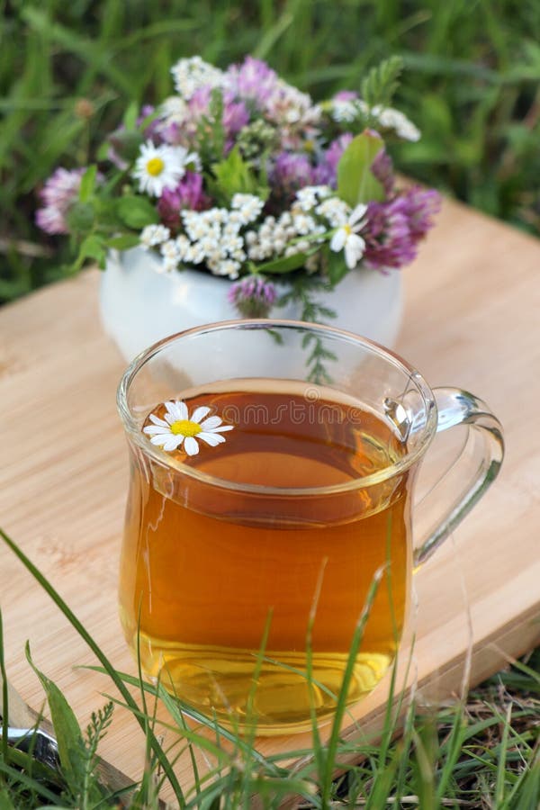 Cup of Aromatic Herbal Tea and Ceramic Mortar with Different ...