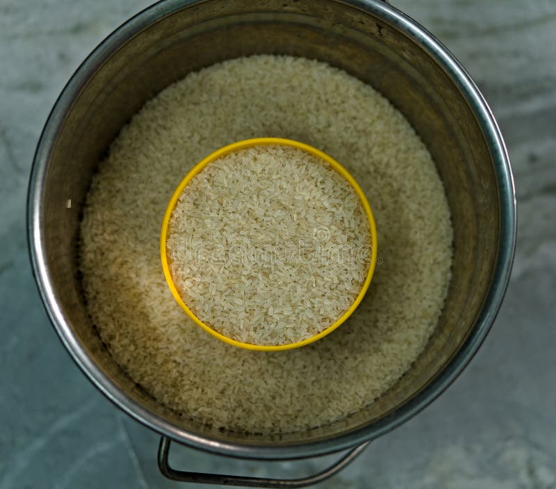 A Cup of Basmati Rice in the Centre of Rice Bucket Stock Photo - Image ...