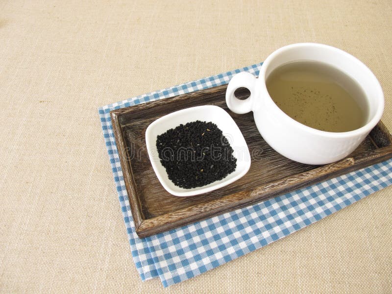 A cup of black cumin tea stock image. Image of warmth - 200758775
