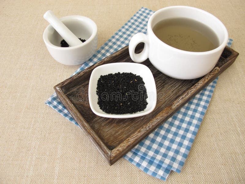 A cup of black cumin tea stock image. Image of cumin - 200758791
