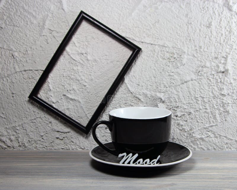 Cup Black Empty with an Inscription Mood and a Photoframe Stock Photo ...