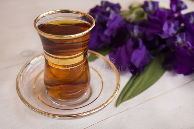 Cup of Black Tea and Blue Iris Flowers Stock Image - Image of morning ...