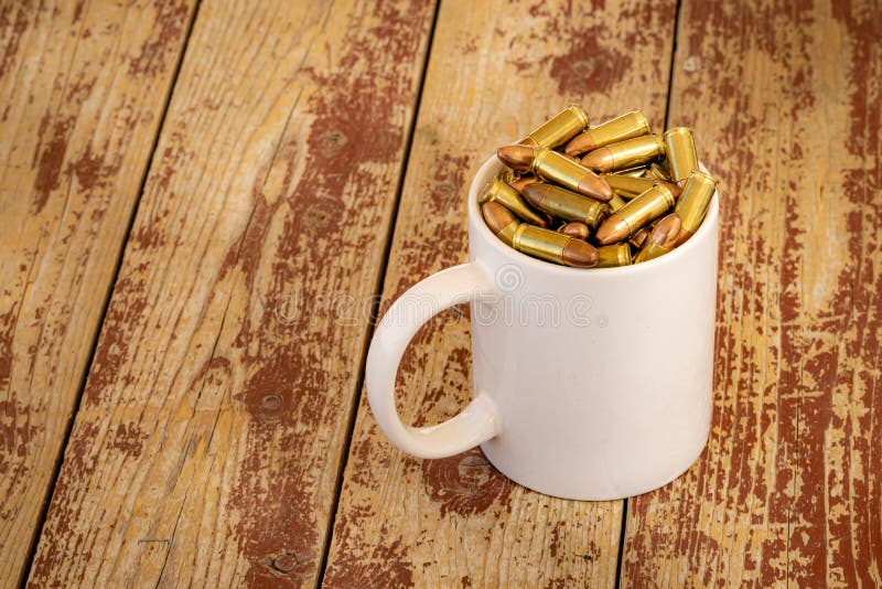 Cup of Bullets on a Wooden Table Stock Photo - Image of firearm ...