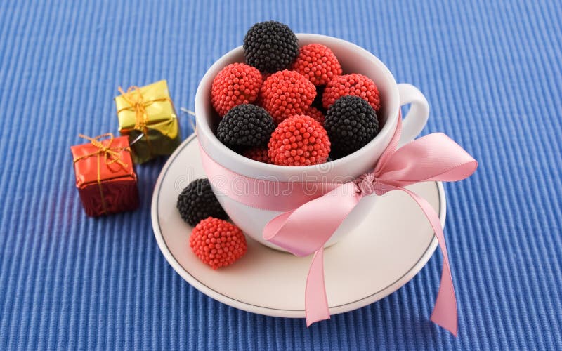 The Cup with Candy and Pink Bow Stock Image - Image of candy, gift ...