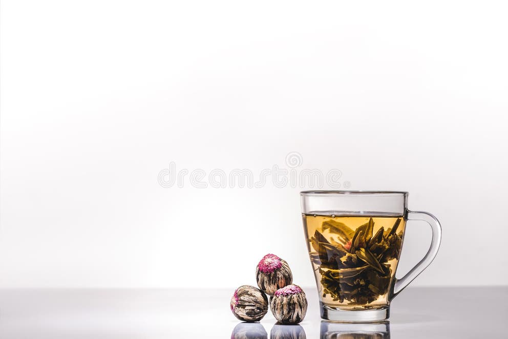 Cup of Chinese Flowering Tea with Tea Balls Stock Image - Image of ...