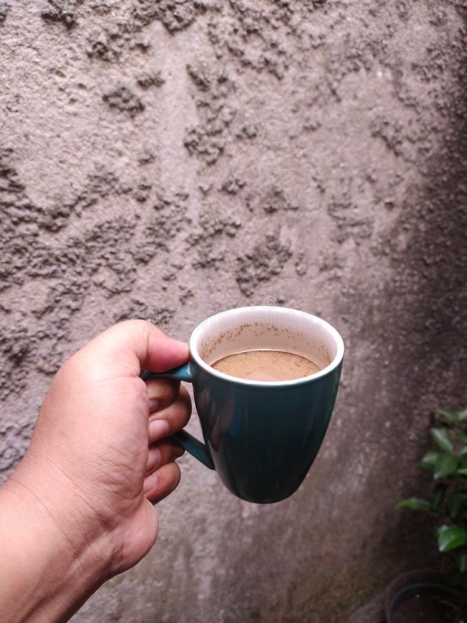 A Cup of Coffee Being Held in the Left Hand Stock Photo - Image of held ...