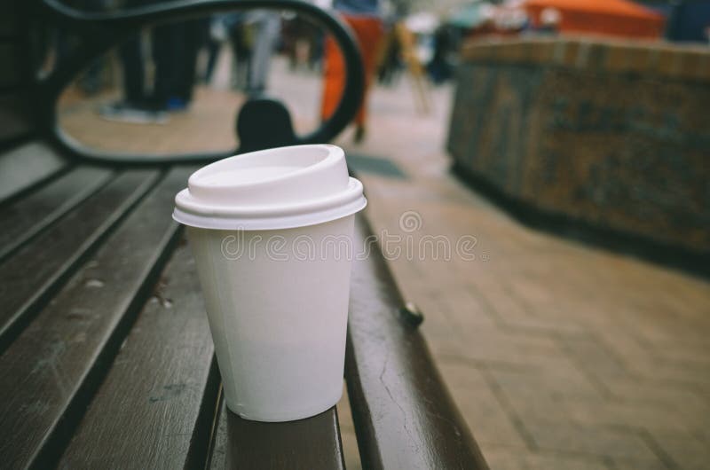 A Cup of Coffee on the Bench Stock Photo - Image of cream, disposal ...