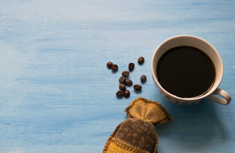 Cup Of Hot Coffee On Blue Background. Stock Photo - Image of home ...
