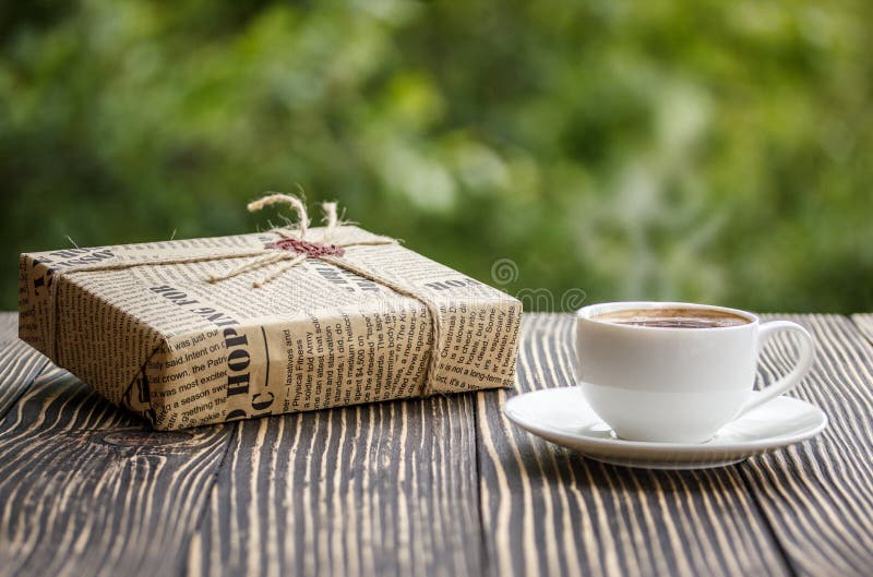 Cup of Coffee and a Box on Wooden Table Stock Photo - Image of table ...