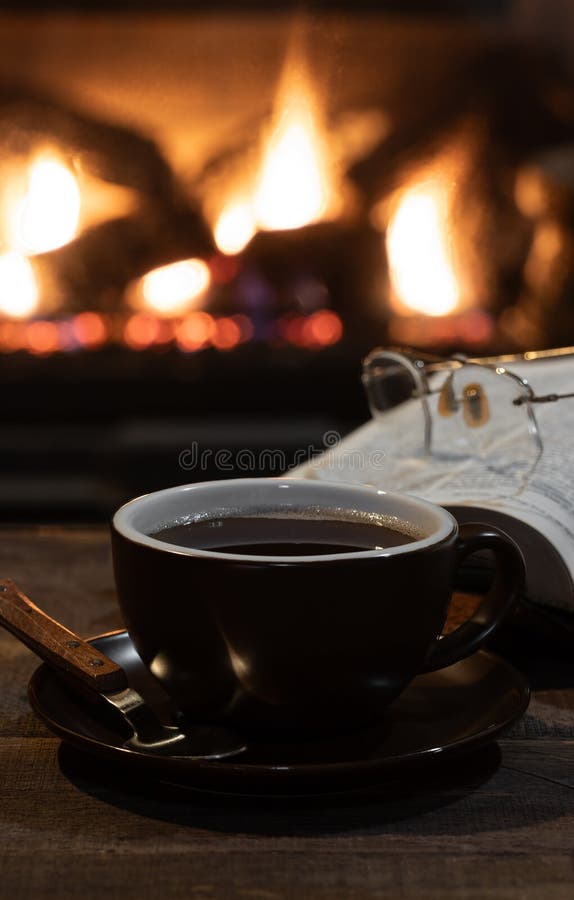 Cup of Coffee with Burning Fireplace in Background Stock Image - Image ...