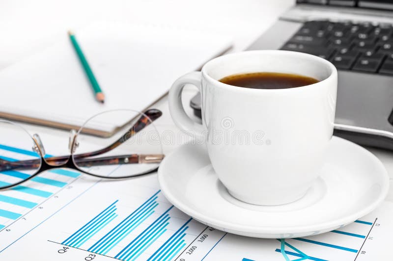 Cup of Coffee with Business Graphs and Laptop at Office Workplace Stock ...