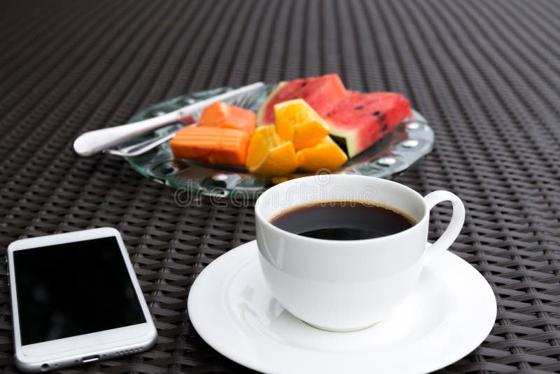Cup of Coffee and Cell Phone with Fruit Salad Stock Image - Image of ...