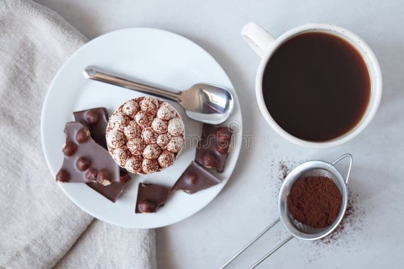 Cup of Coffee and Chocolate Cake and Chocolate on White Table, Top View ...