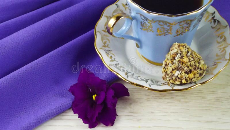 A Cup of Coffee and a Violet Flower. Stock Photo - Image of shape ...