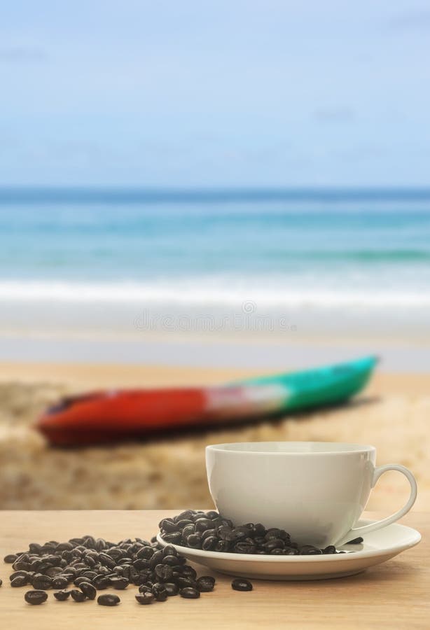 Cup of Coffee with Coffee Bean on the Beach Background Stock Photo ...