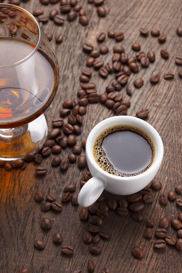 Cup of Coffee, Cognac Glass and Coffee Beans Stock Photo - Image of ...