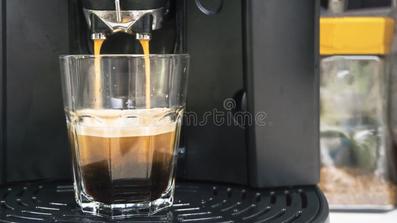Cup of Coffee with Drop of Water from Bean To Coffee Machine in Stock ...