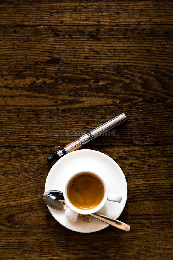 Cup of Coffee and E-cigarette on a Wooden Counter Stock Image - Image ...