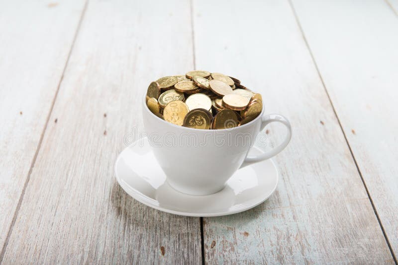 Cup of Coffee with Gold Coins Stock Photo - Image of coffee, consumer ...