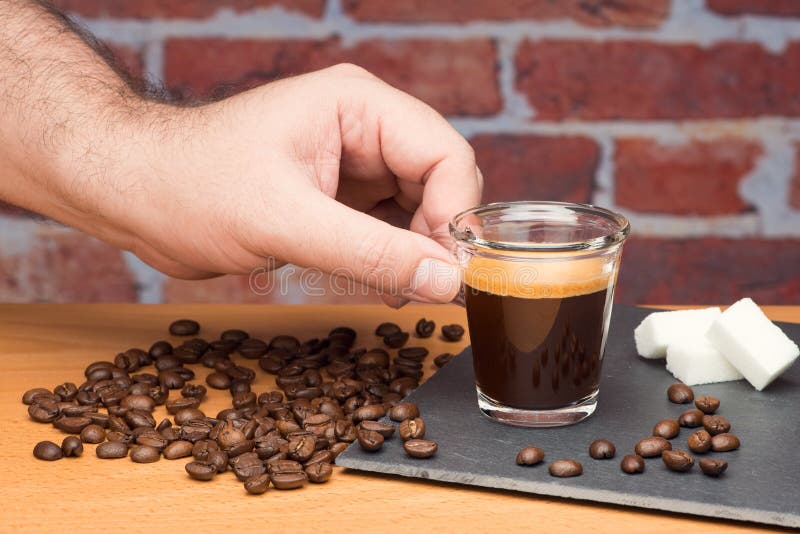 Cup of coffee with hand stock image. Image of brick, giving - 43865109