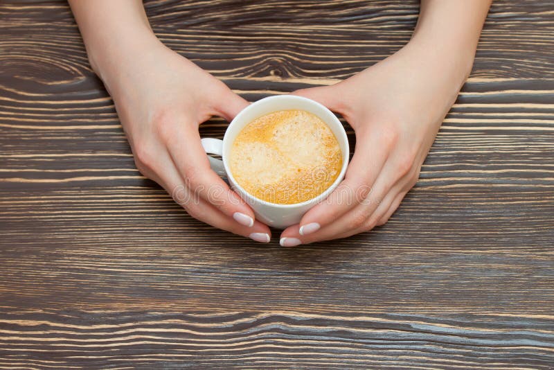 Cup of coffee in hand stock photo. Image of rest, cappuccino - 50006808