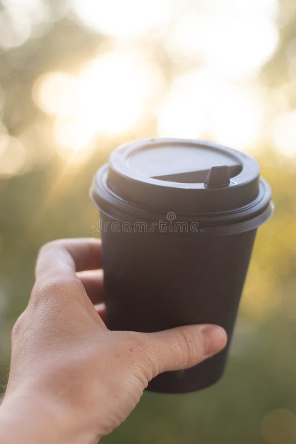 A Cup of Coffee in Hand. Coffee in Hand. Coffee in Nature Stock Image ...