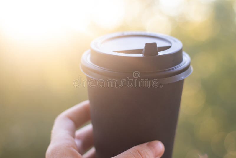 A Cup of Coffee in Hand. Coffee in Hand. Coffee in Nature Stock Image ...