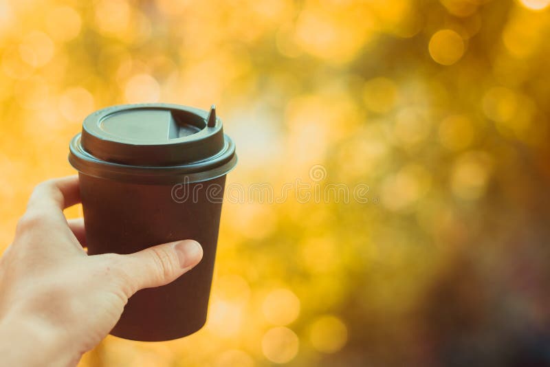 A Cup of Coffee in Hand. Coffee in Hand. Coffee in Nature Stock Image ...
