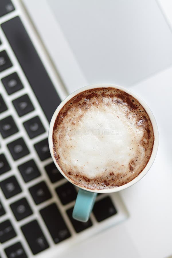 A Cup of Coffee on a Laptop Stock Photo - Image of black, information ...