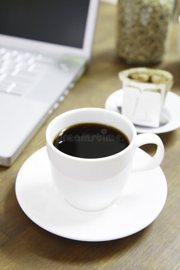 Cup of coffee and laptop stock photo. Image of refreshment - 37030956