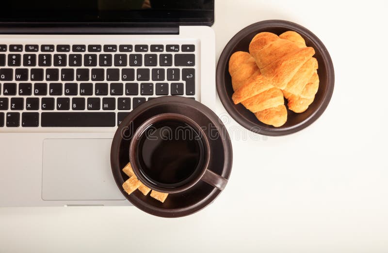 Cup of coffee and a laptop stock photo. Image of workplace - 76392242