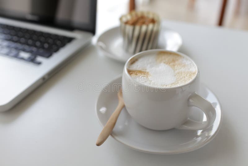 A Cup of Coffee and a Laptop Stock Photo - Image of closeup, laptop ...