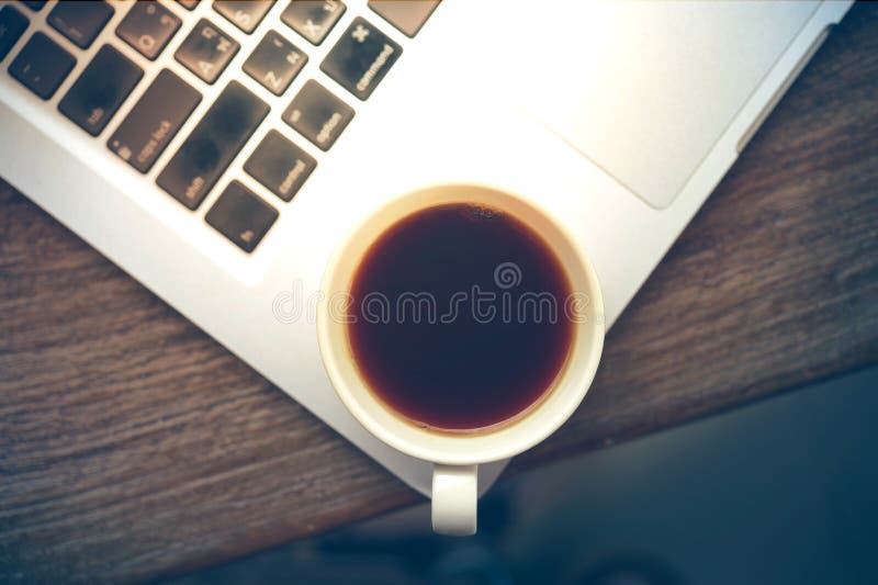 Cup of Coffee and Laptop on Wooden Table. Stock Image - Image of glass ...