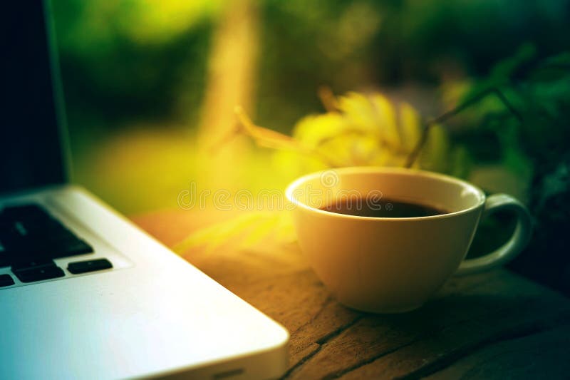 Cup of Coffee and Laptop on Wooden Table. Stock Photo - Image of wood ...