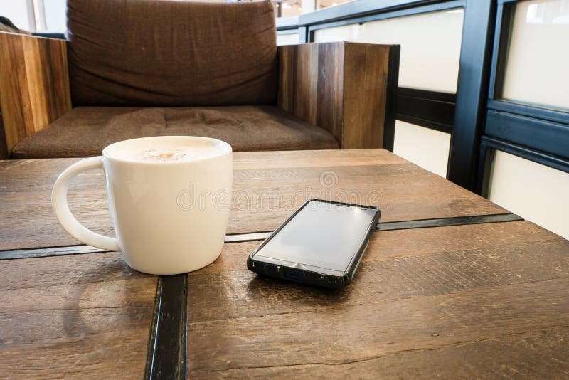 A Cup of Coffee Latte and Smart Phone Stock Photo - Image of restaurant ...