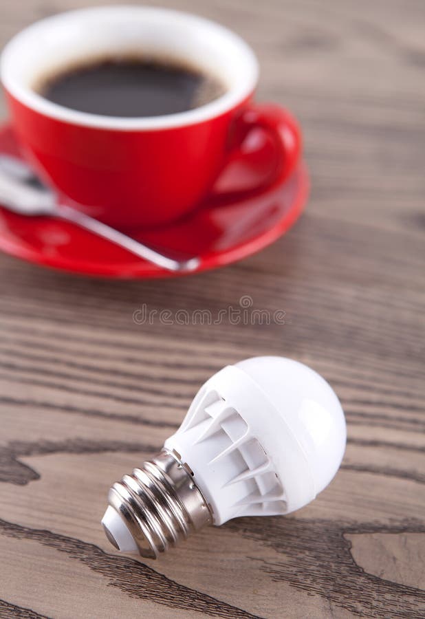 A Cup of Coffee and a Light Bulb Stock Photo - Image of atmosphere ...