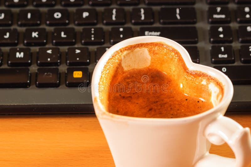Cup of Coffee Next To Computer Keyboard. Stock Photo - Image of ...