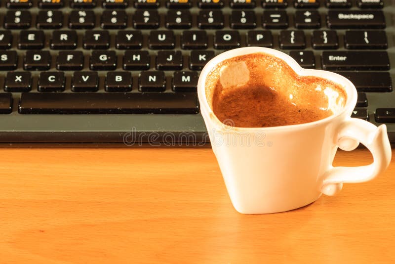 Cup of Coffee Next To Computer Keyboard. Stock Photo - Image of desk ...