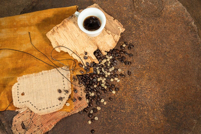 A Cup of Coffee with Old Wood and Coffee Beans on Rusty Texture. Stock ...