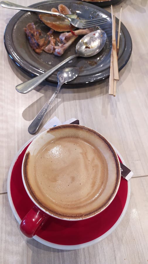 A Cup of Coffee with Palm Sugar in a Red Cup on the Table with Another ...