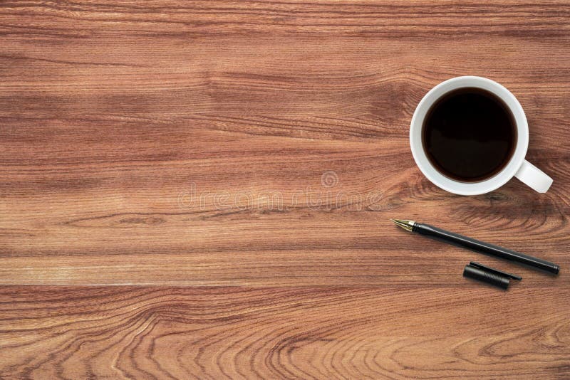 Cup of Coffee and Pen are on Top of Wood Table. Top View with Copy ...