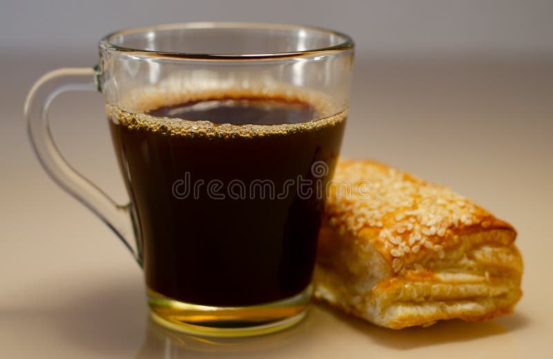 A Cup of Coffee with Puff Pastry, Shot at an Angle Stock Photo - Image ...