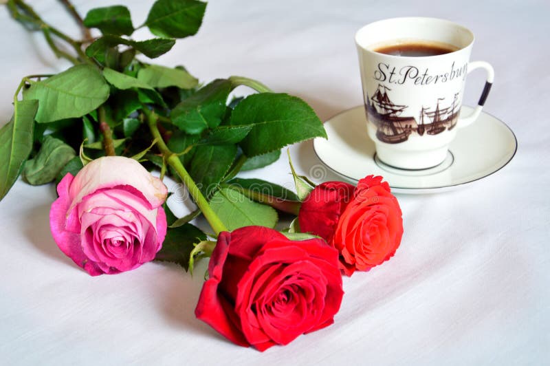 Cup of Coffee and Red Roses on a White Tablecloth. Stock Photo - Image ...